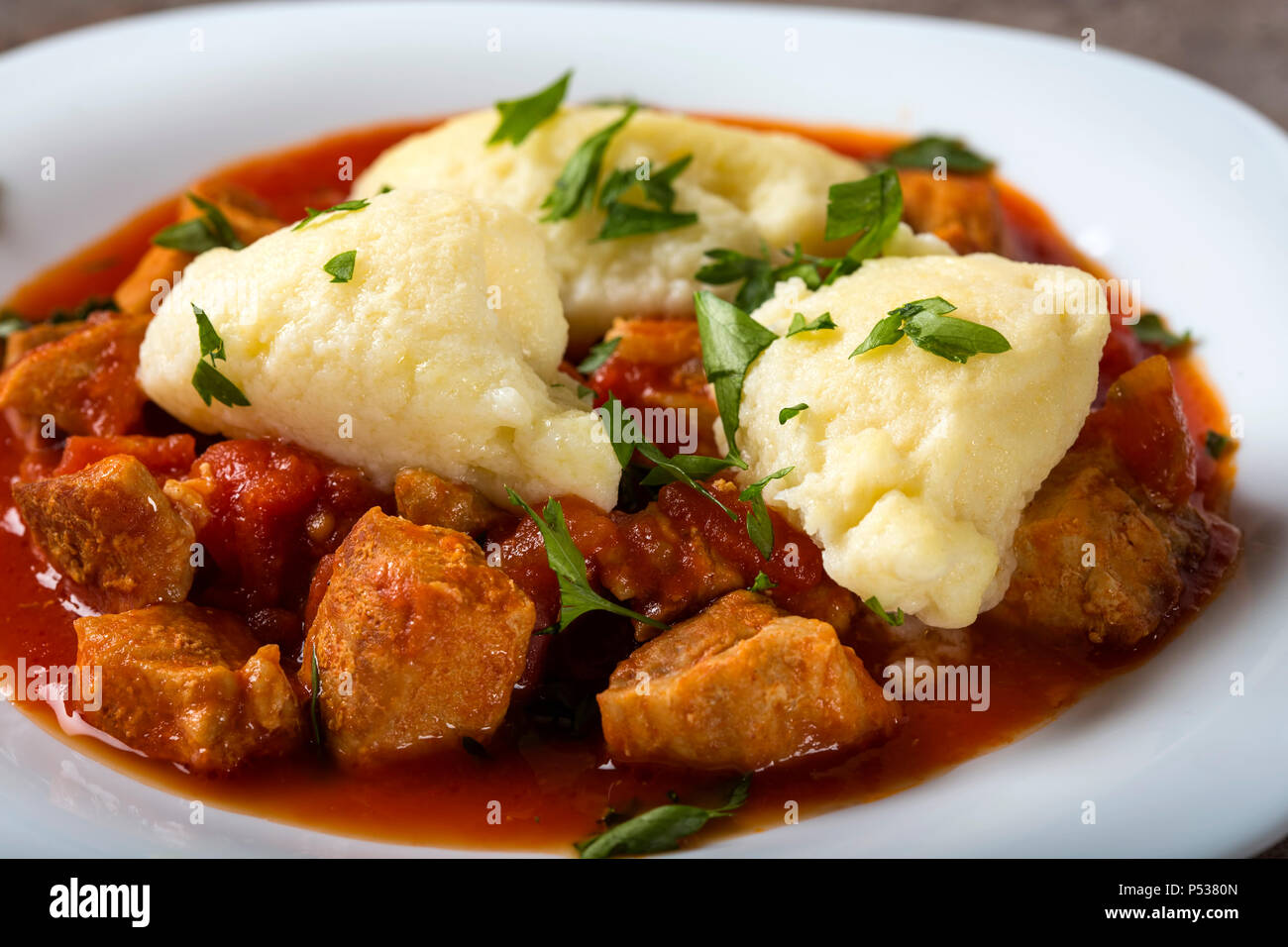Traditional Hungarian food: Goulash with dumplings made from eggs ...