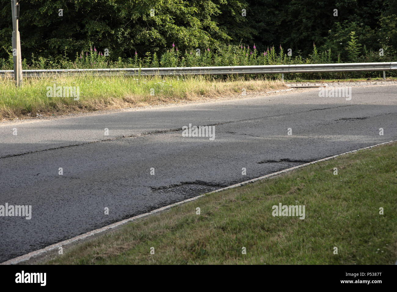 Bad road surfaces on Britain's roads. Junction of Pyebush Roundabout ...