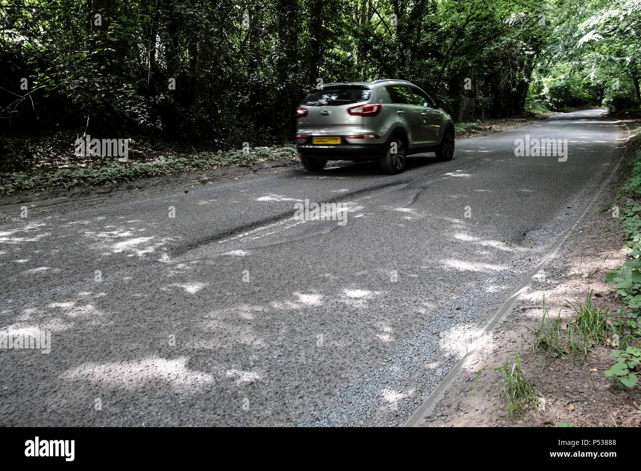 Bad road surfaces on Britain's roads. Moving car. Junction of Gorelands ...