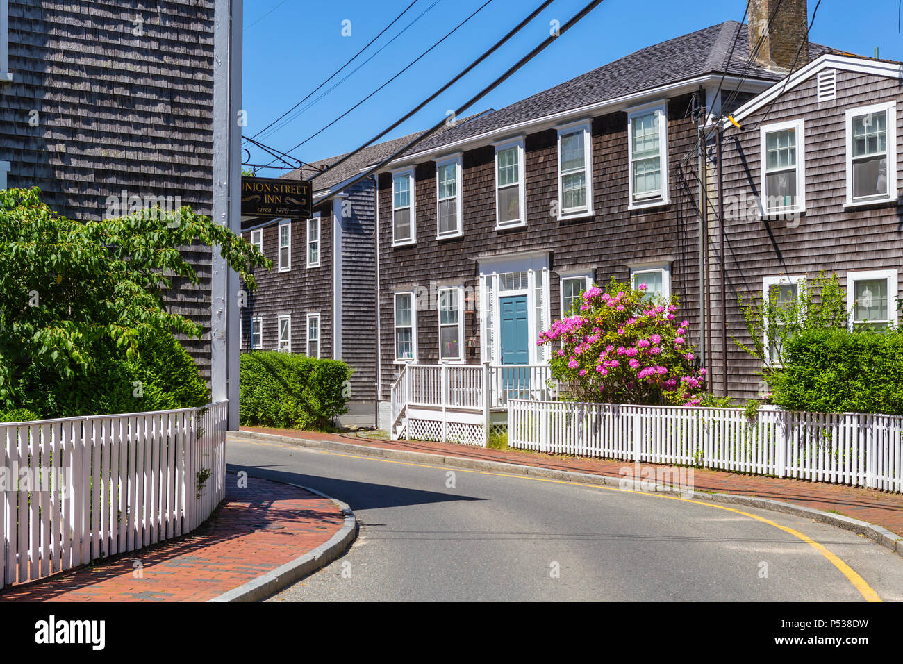 A view of traditional cedar shake-sided buildings in Nantucket ...