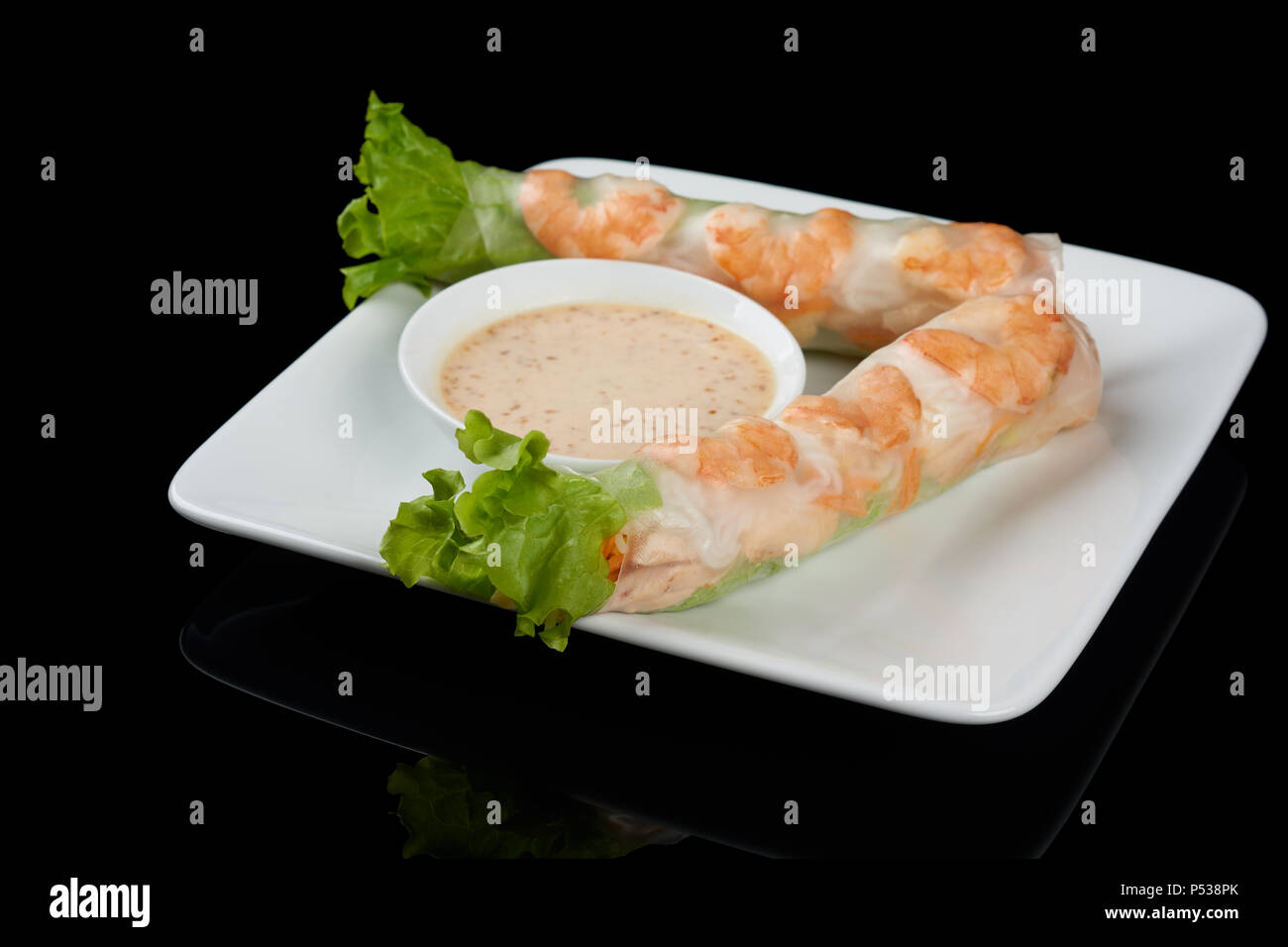 Vietnamese dish Nem cuon spring rolls with sauce on rectangular white ...