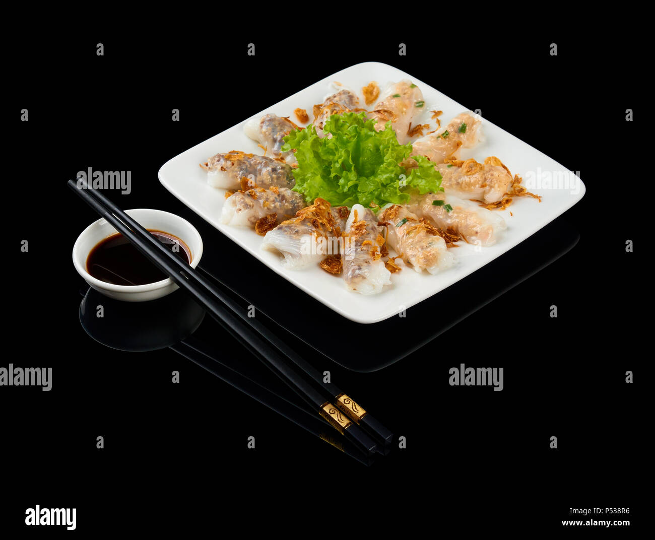 Banh Cuon vietnamese steamed rice rolls on black reflective background ...