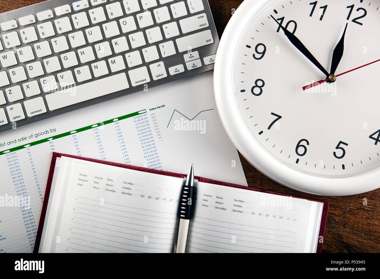 diary and office supplies and clock Stock Photo - Alamy