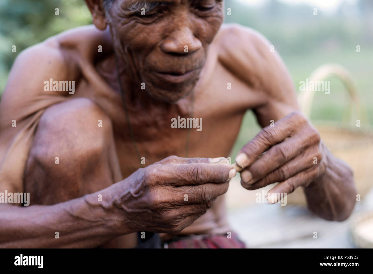Old men in rural areas are holding cigarettes Stock Photo - Alamy