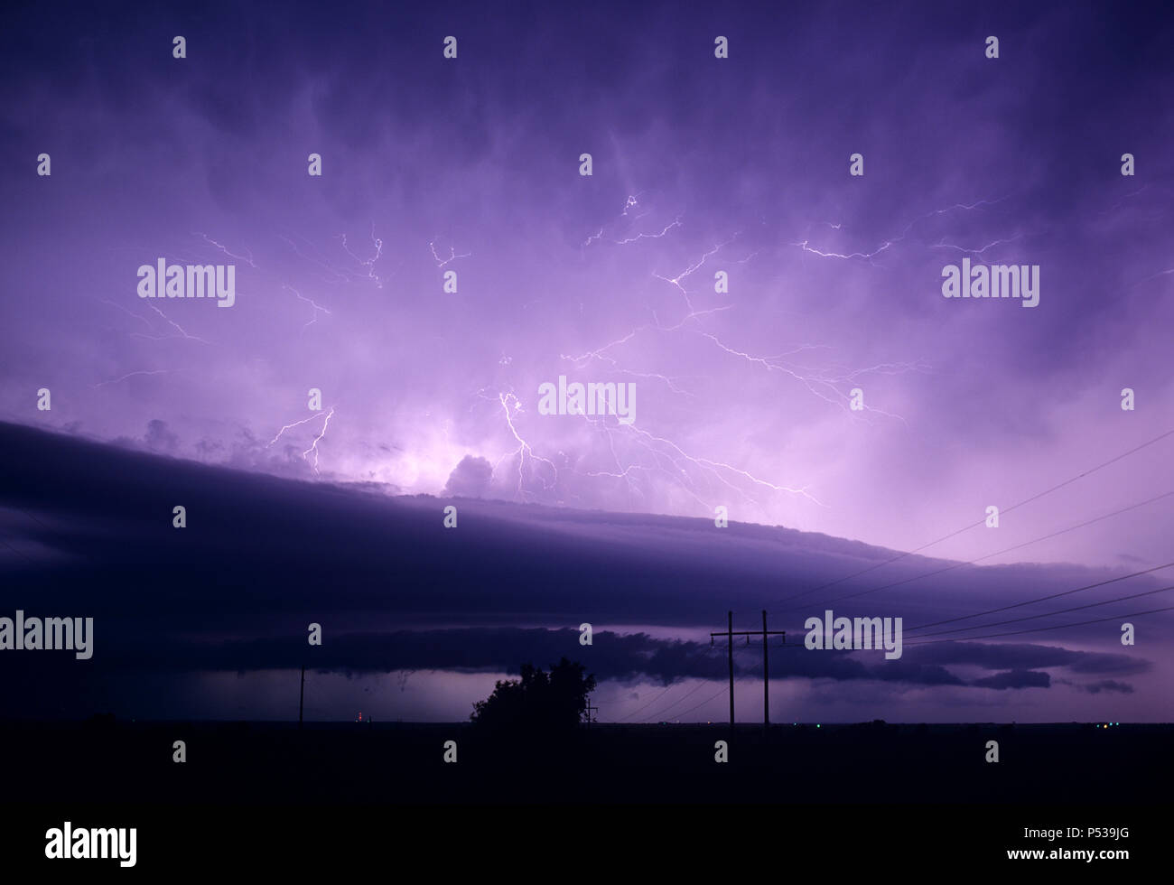A bolt of cloud to cloud lightning crawls across the anvil of a ...