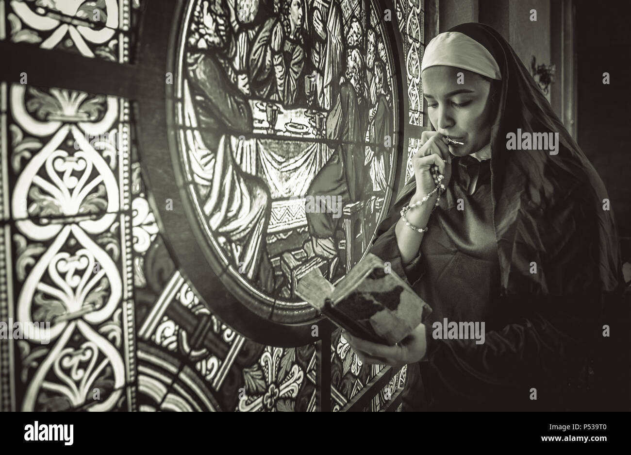 Nun praying in a monastery Stock Photo - Alamy