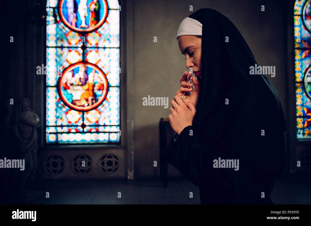 Nun praying in a monastery Stock Photo - Alamy