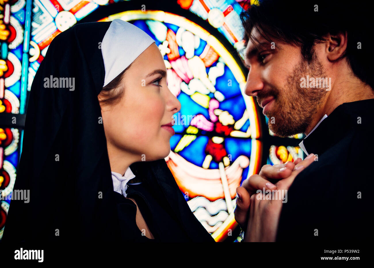 Nun and priest praying and spending time in the monastery Stock Photo ...