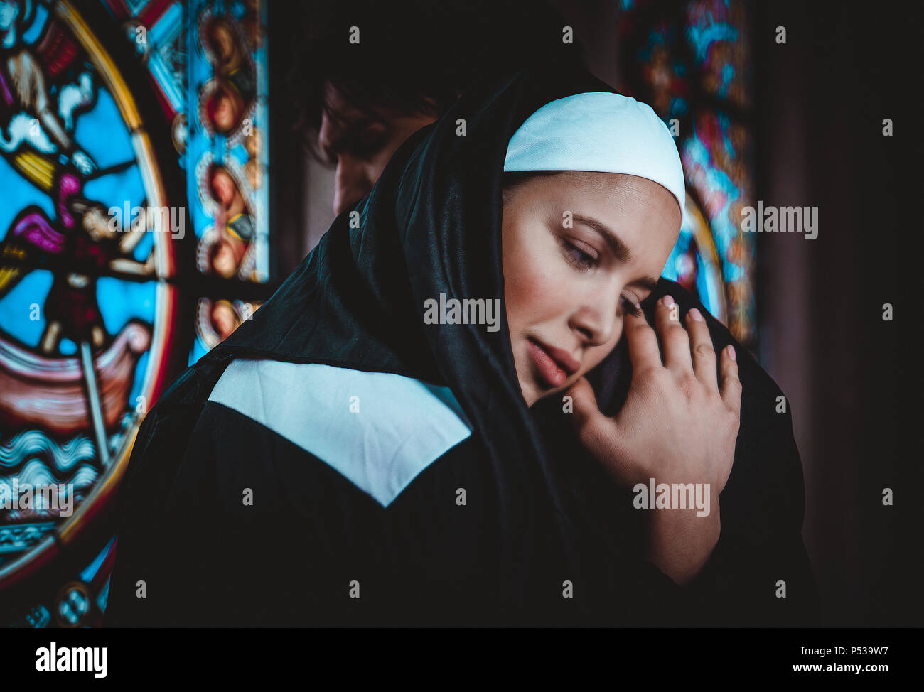Praying nun holding rosary hi-res stock photography and images - Alamy