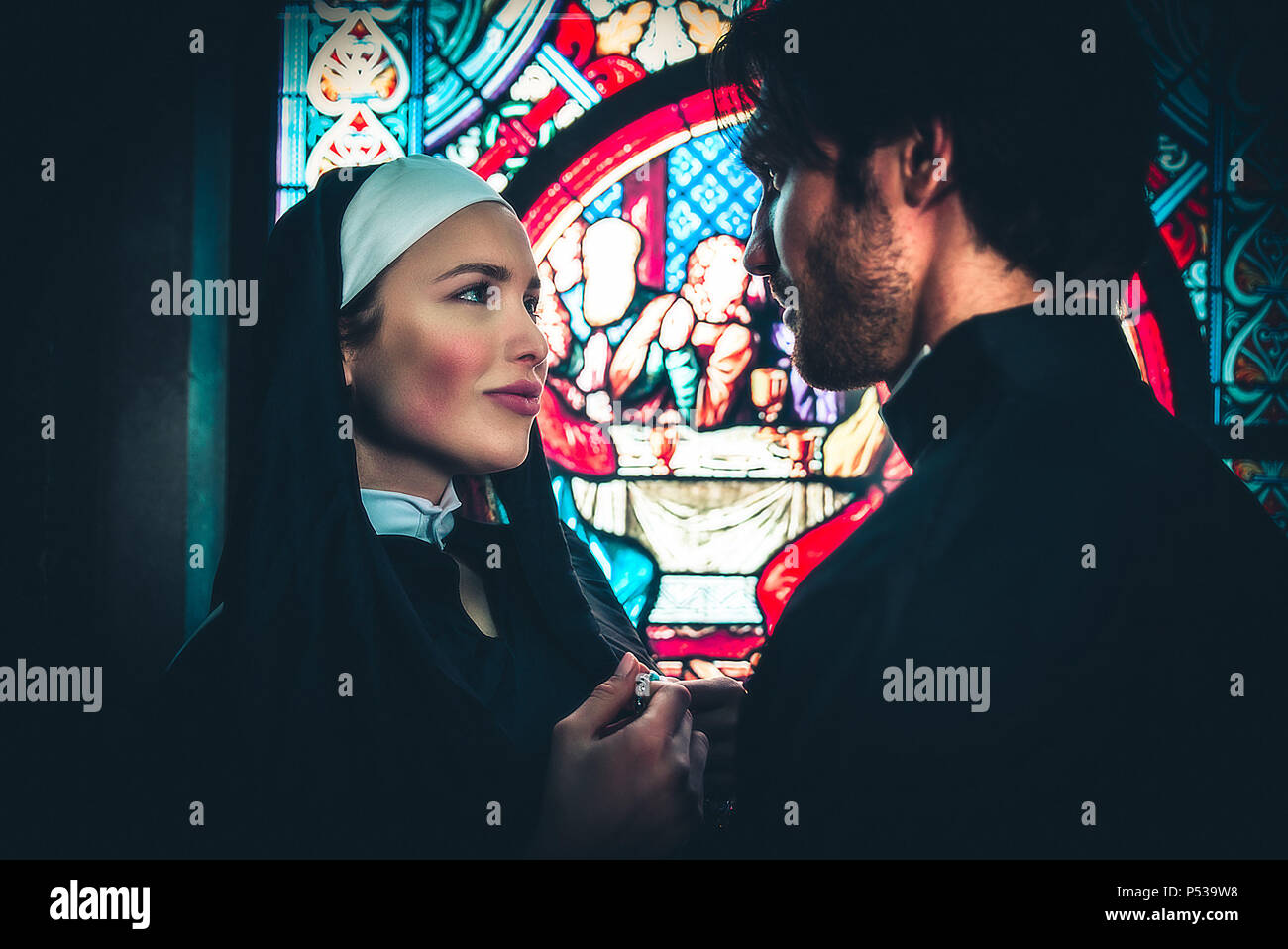 Praying nun holding rosary hi-res stock photography and images - Alamy