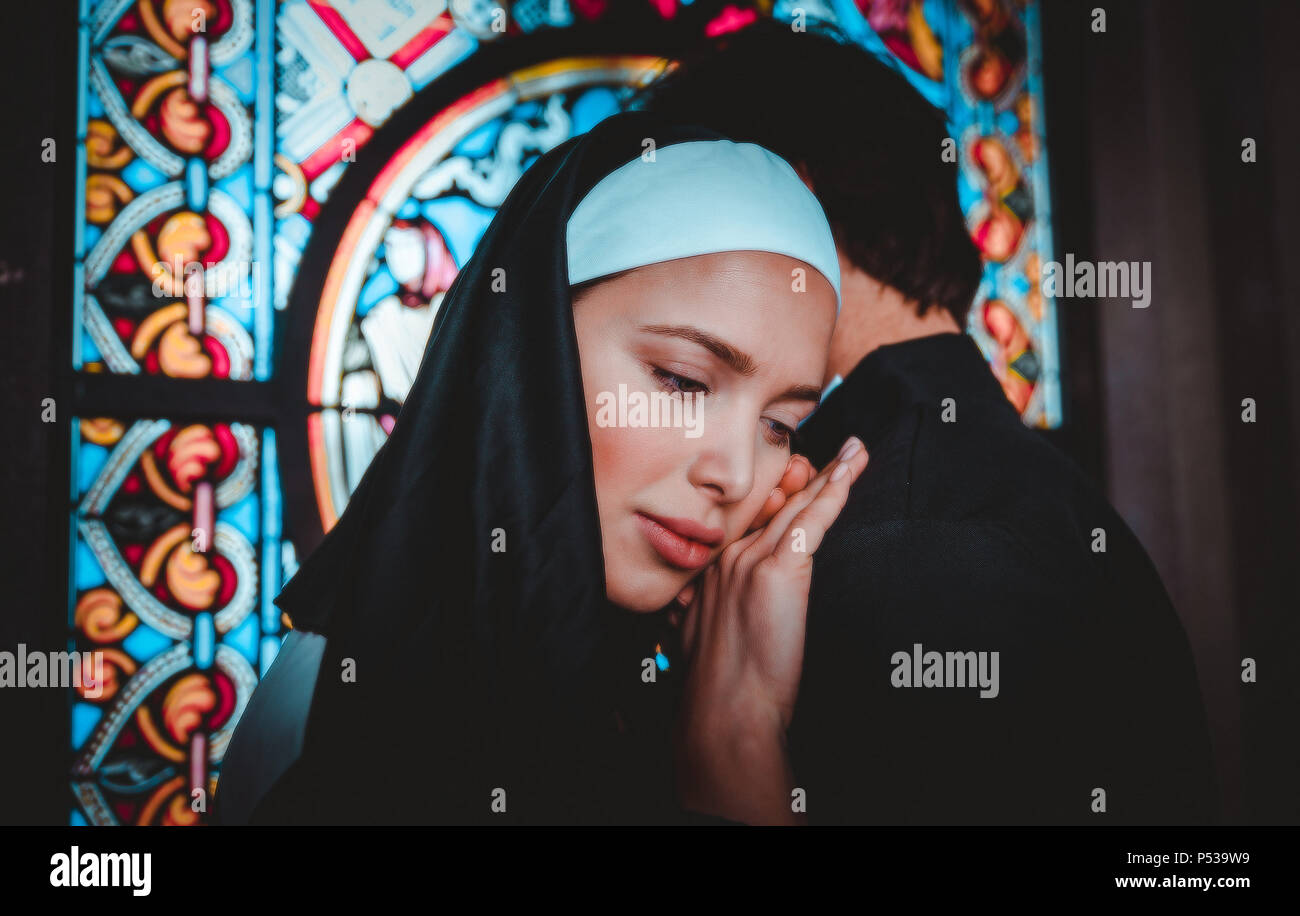 Praying nun holding rosary hi-res stock photography and images - Alamy