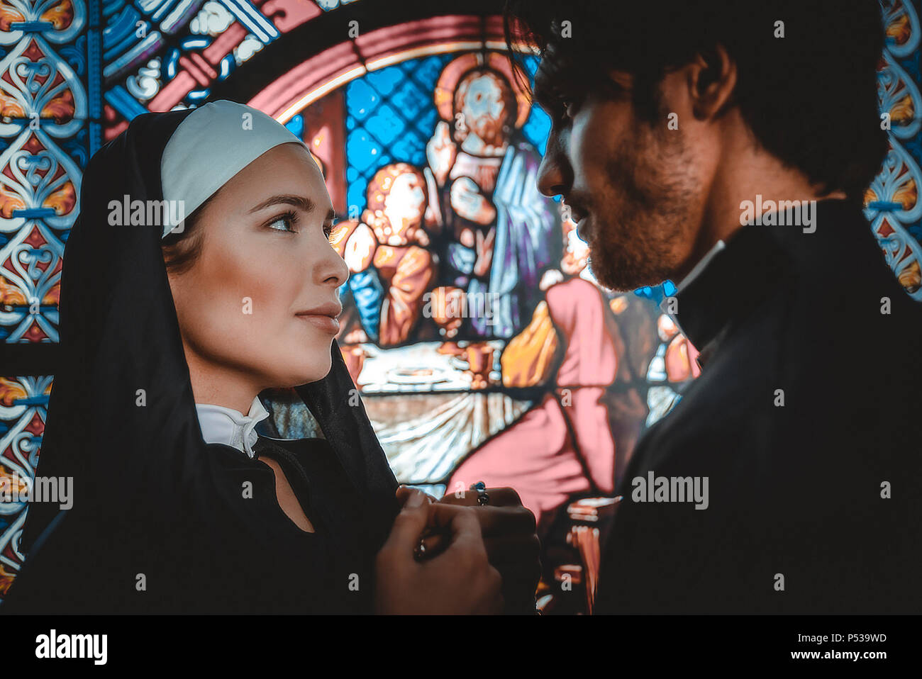 Nun and priest praying and spending time in the monastery Stock Photo ...