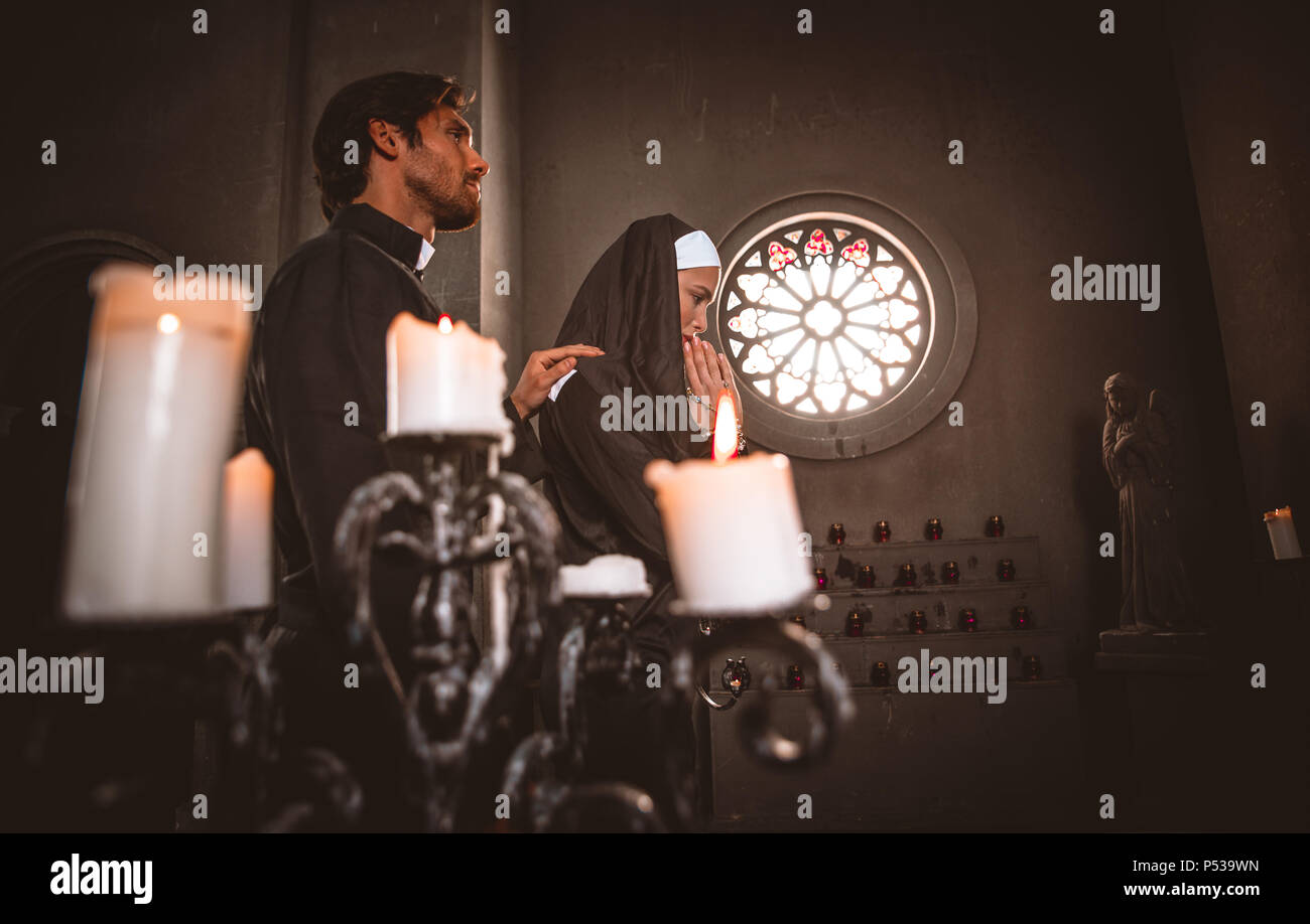 Praying nun holding rosary hi-res stock photography and images - Alamy