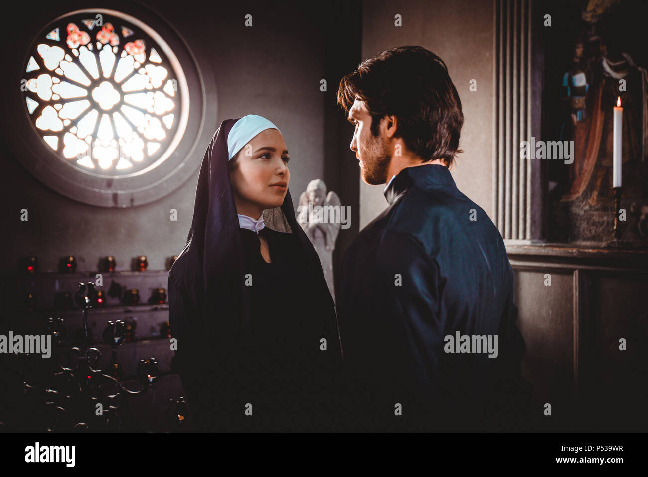 Praying nun holding rosary hi-res stock photography and images - Alamy