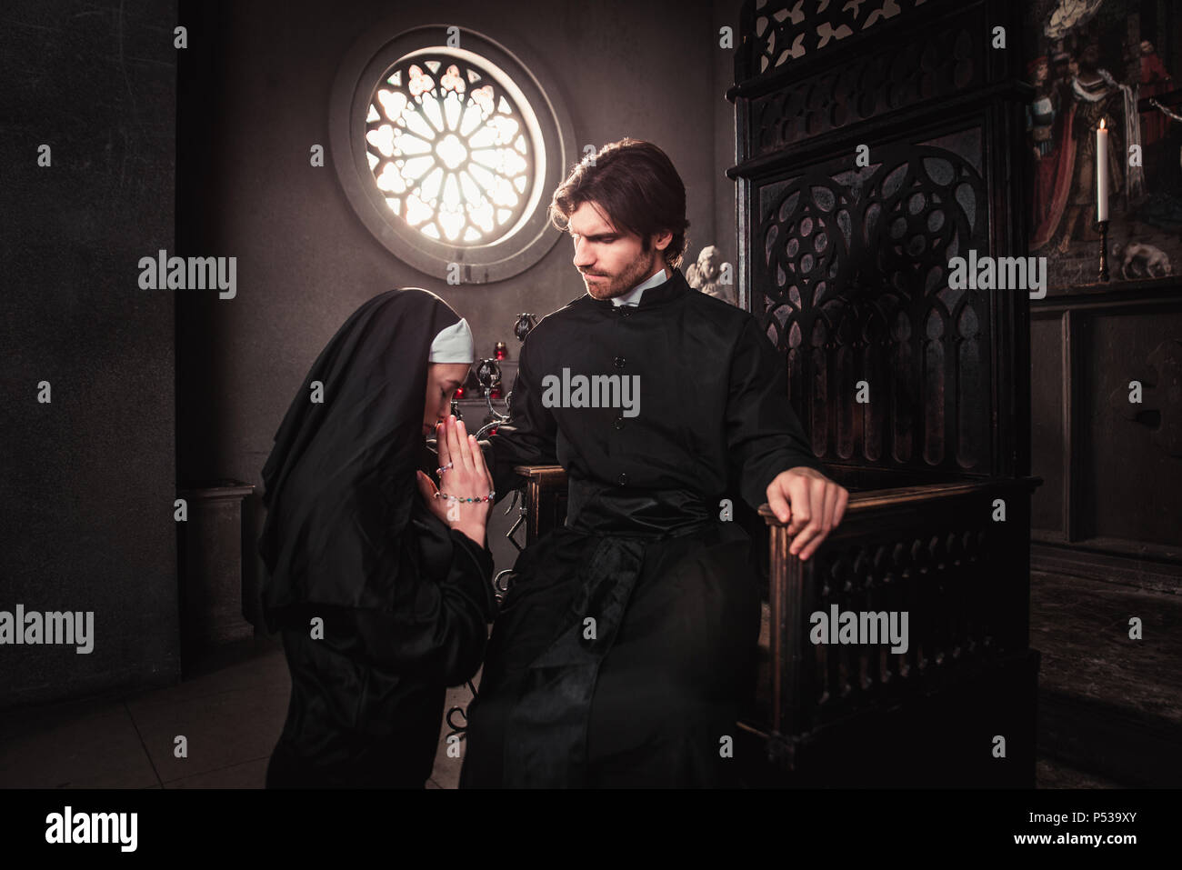 Praying nun holding rosary hi-res stock photography and images - Alamy