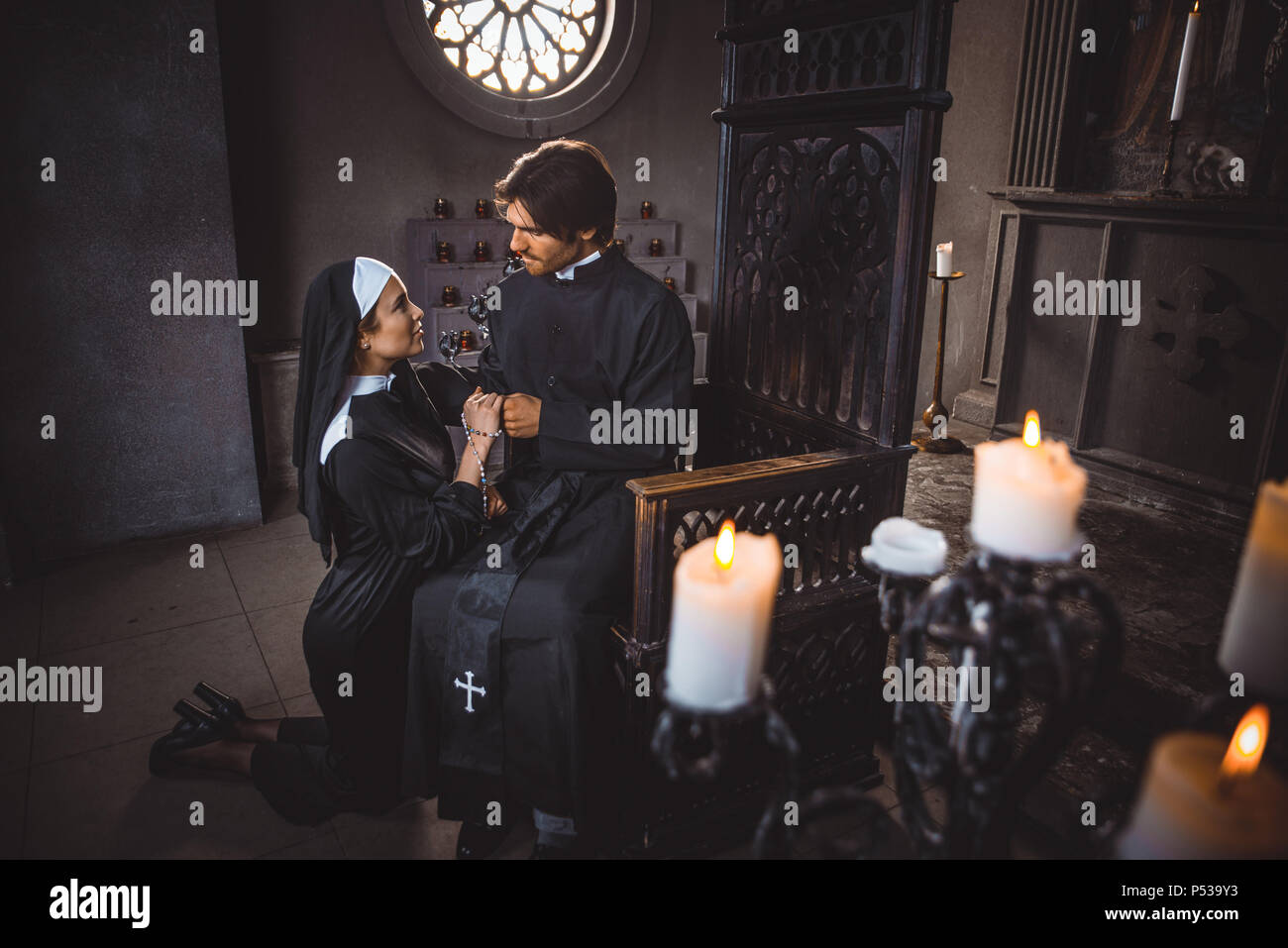 Praying nun holding rosary hi-res stock photography and images - Alamy