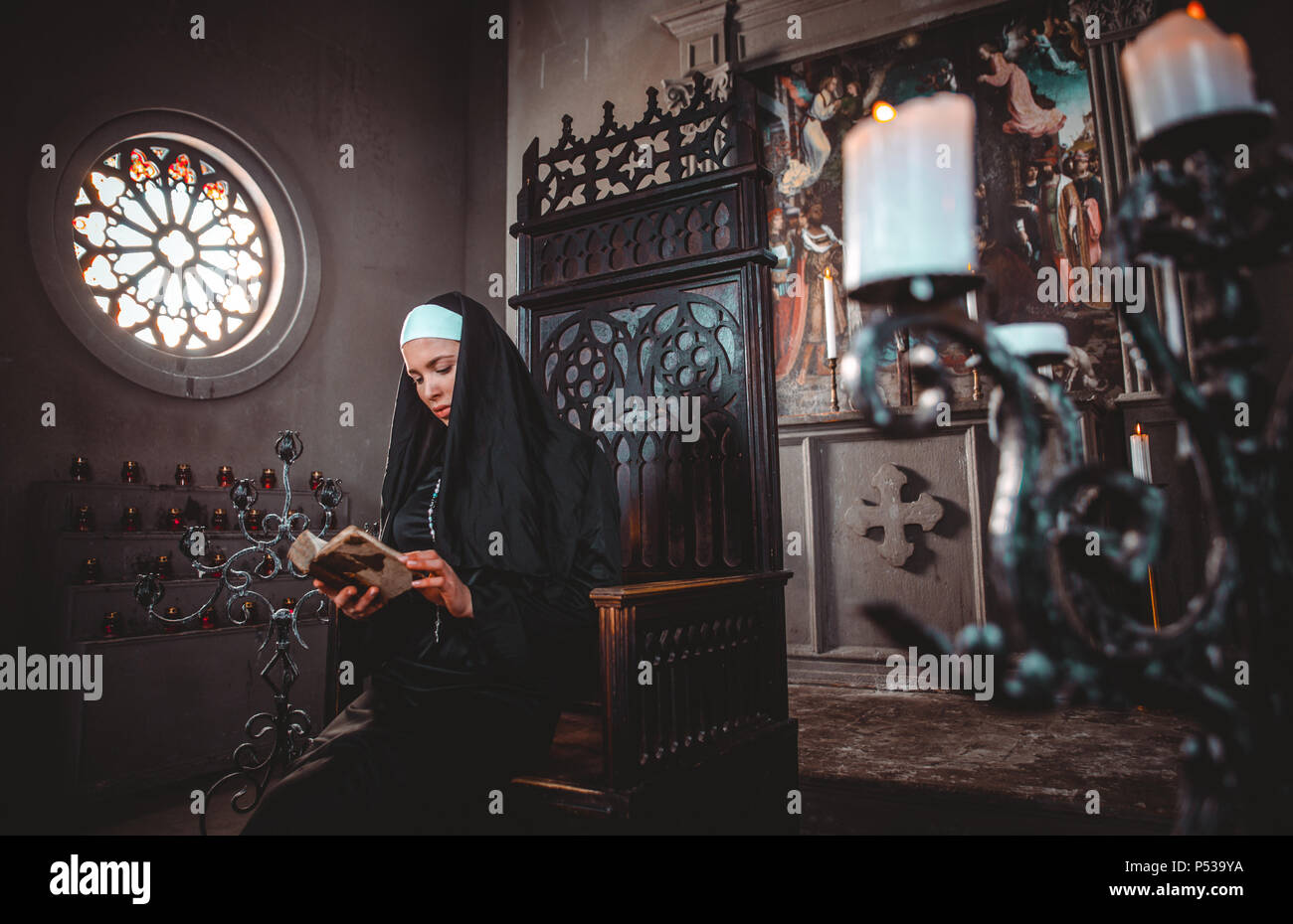 Nun praying in a monastery Stock Photo - Alamy