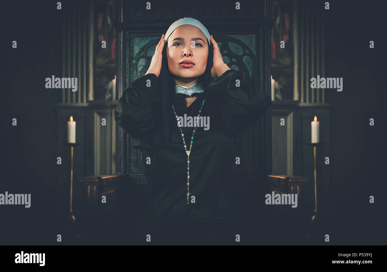 Nun praying in a monastery Stock Photo - Alamy