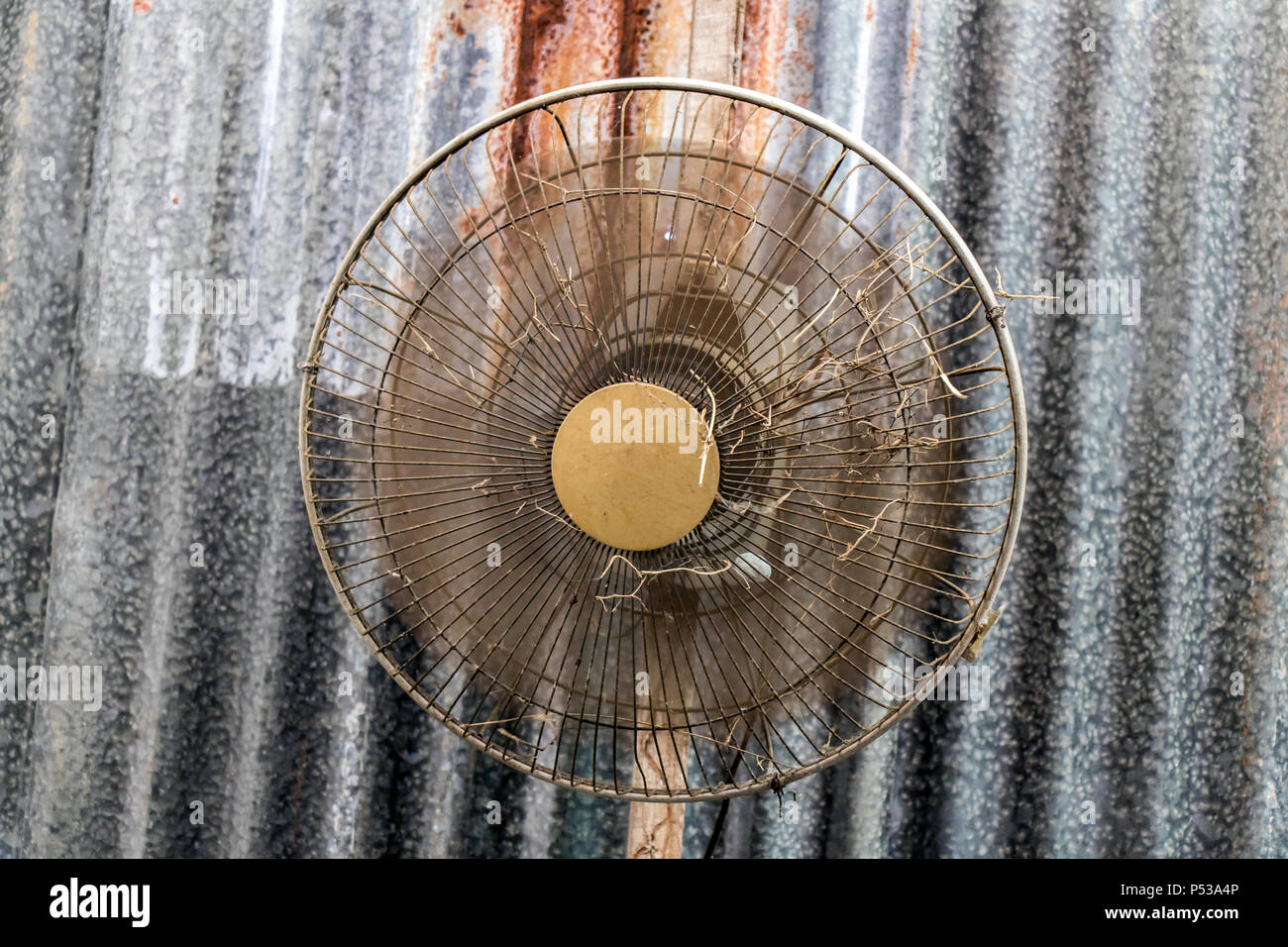 A old fan rotate on metal roof Stock Photo - Alamy