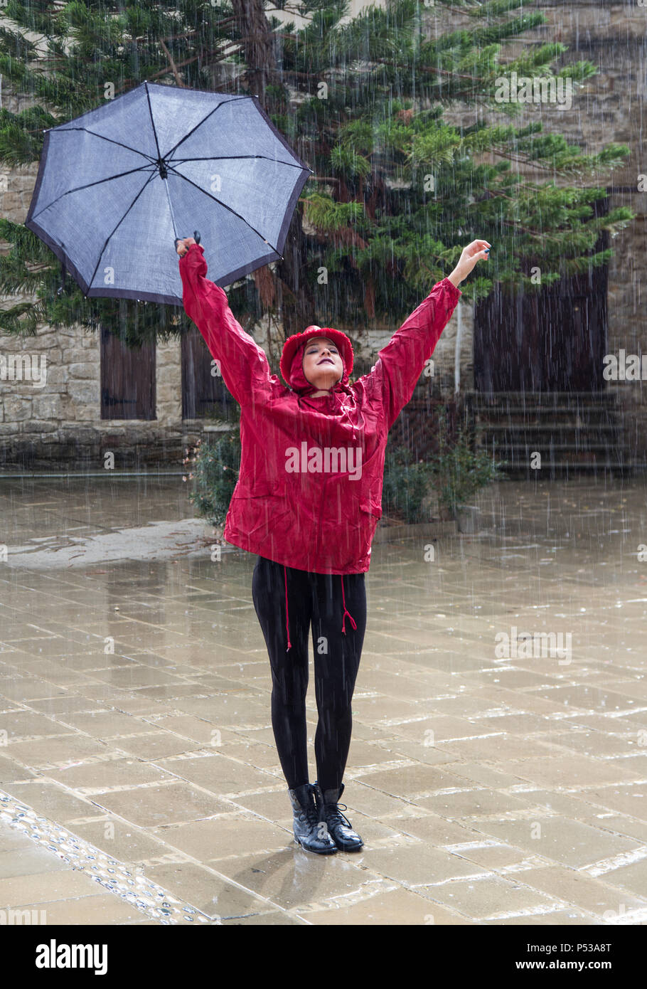 Woman standing in the rain hi-res stock photography and images - Alamy