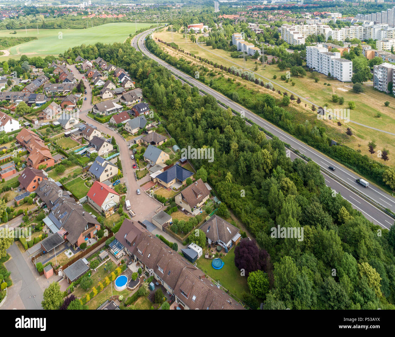Aerial view of a motorway running in Germany between a traditional old ...