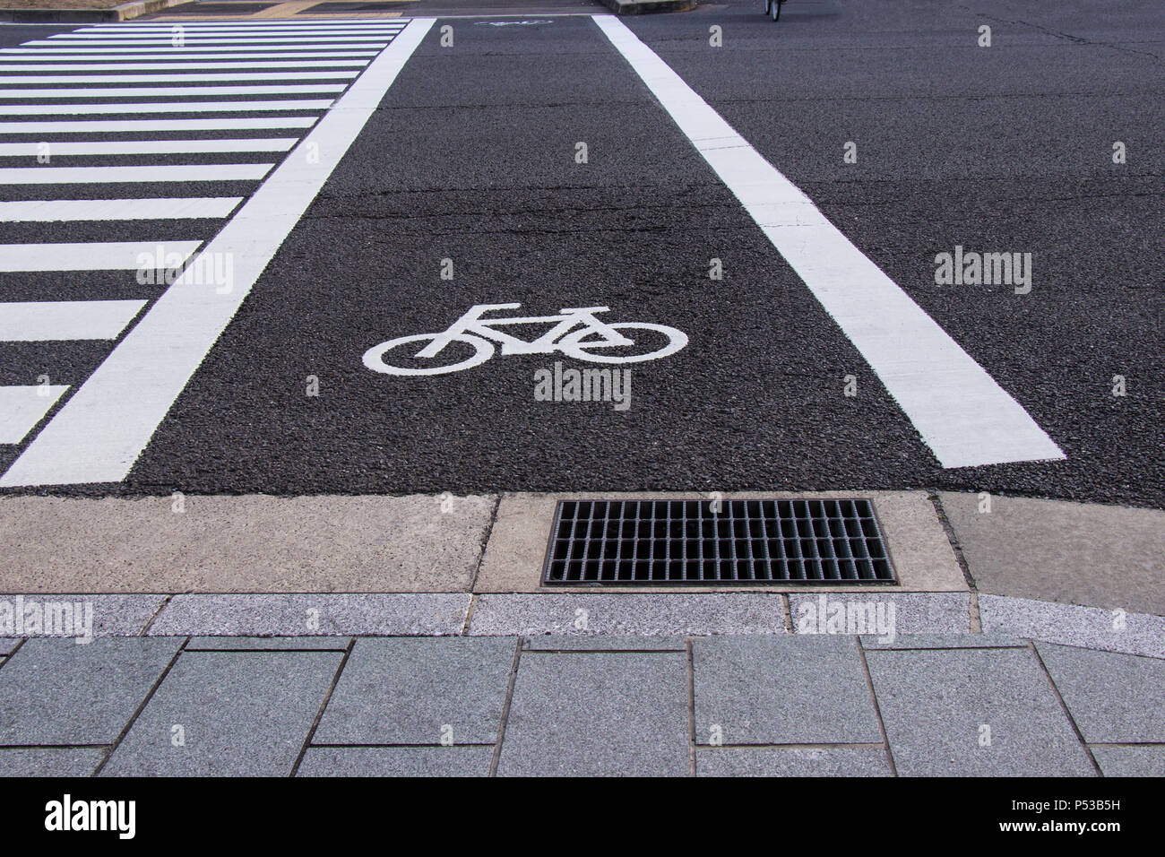 Bike lane symbol with crosswalk on street and air ventilation Stock ...