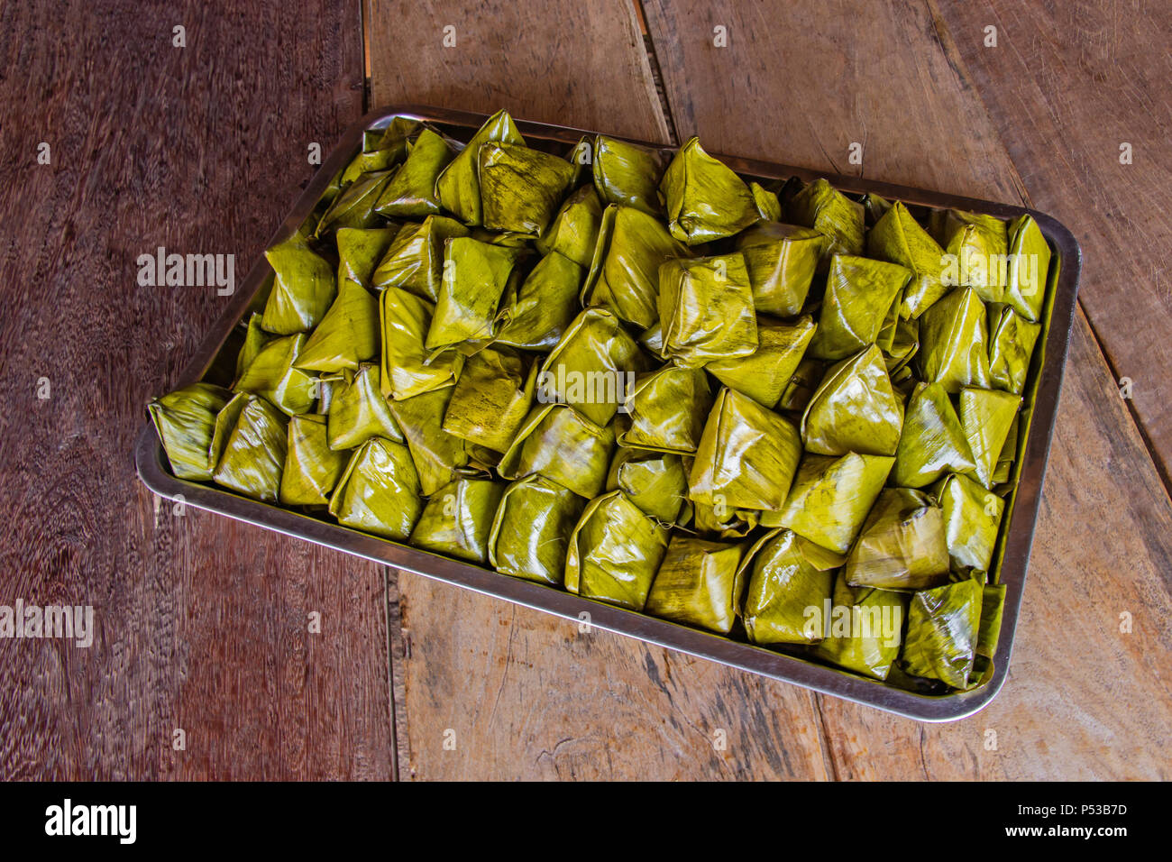 Stuffed Dough Pyramid Dessert put on tray on brown wooden background ...