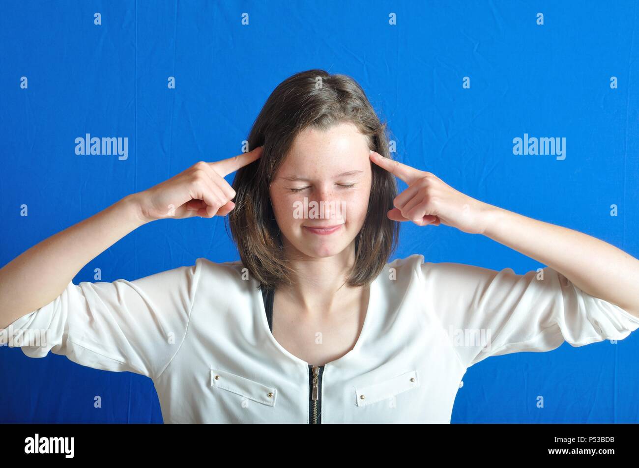 Portrait of teenage girl thinking Stock Photo - Alamy