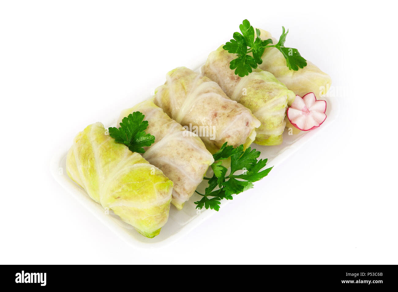 Freshly frozen semi-finished stuffed cabbage rolls. Isolate on white ...