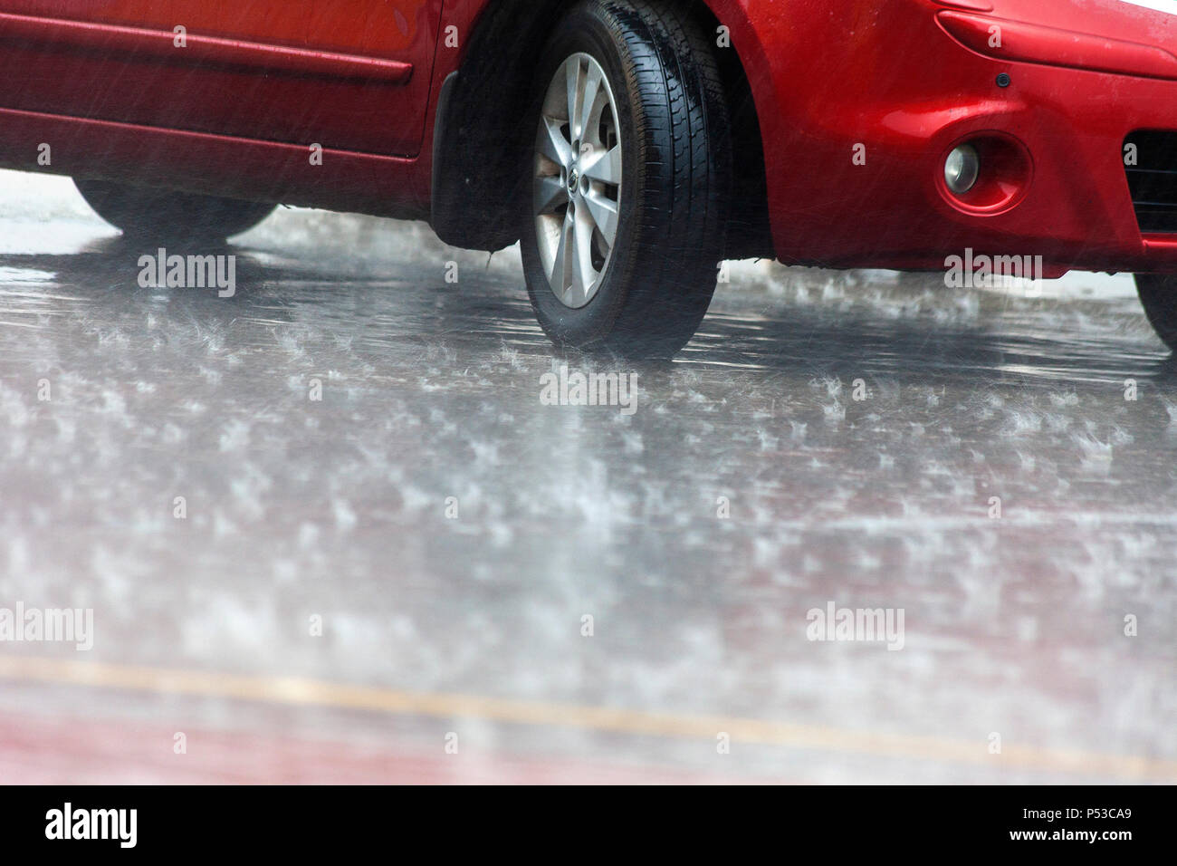 Summer shower. Car wheels in the summer rain Stock Photo - Alamy