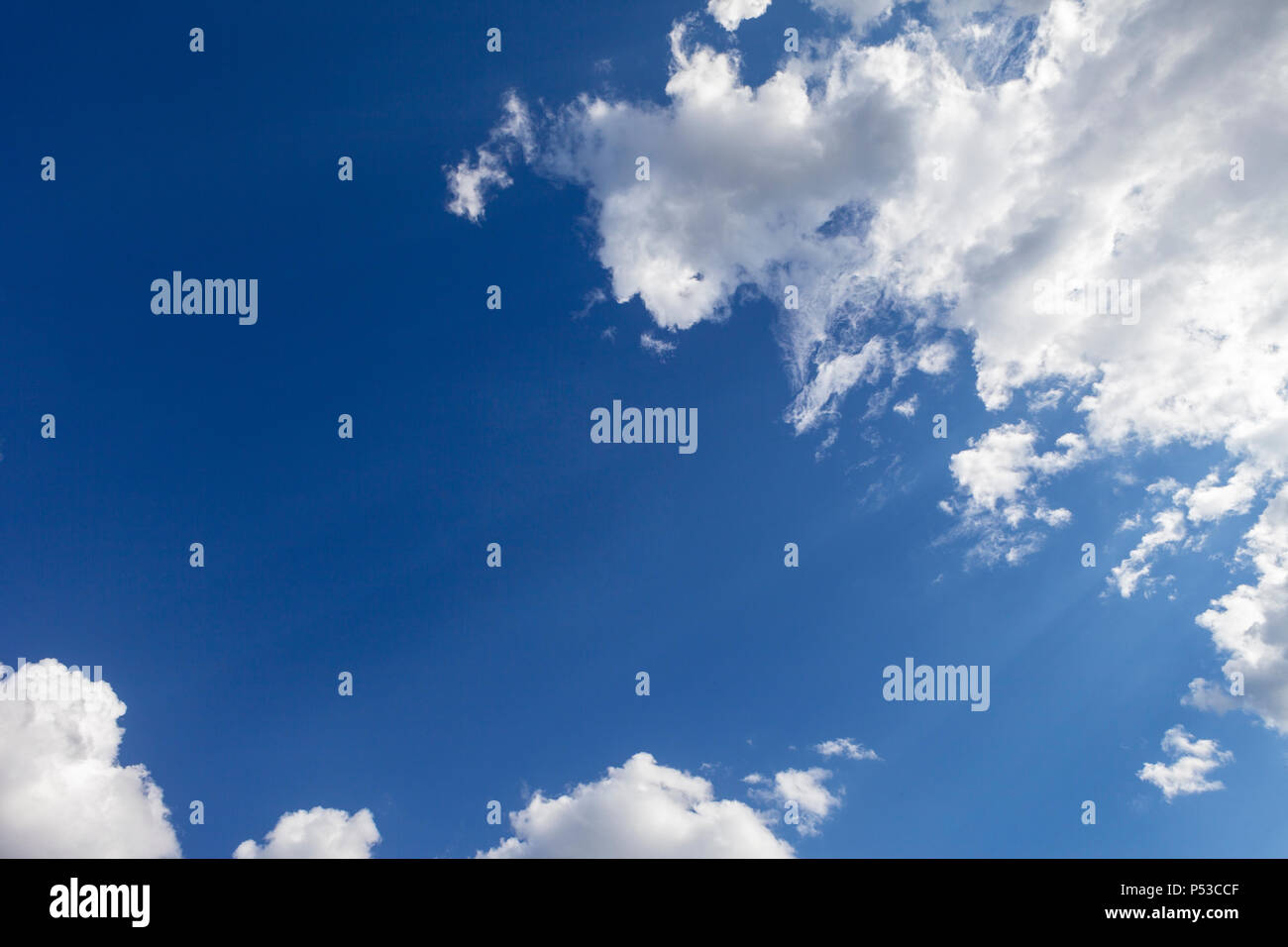 Blue sky background with clouds close-up Stock Photo - Alamy