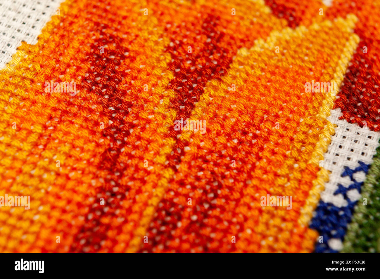Cross-stitch. Macro photography of embroidery sites. Shooting with a ...