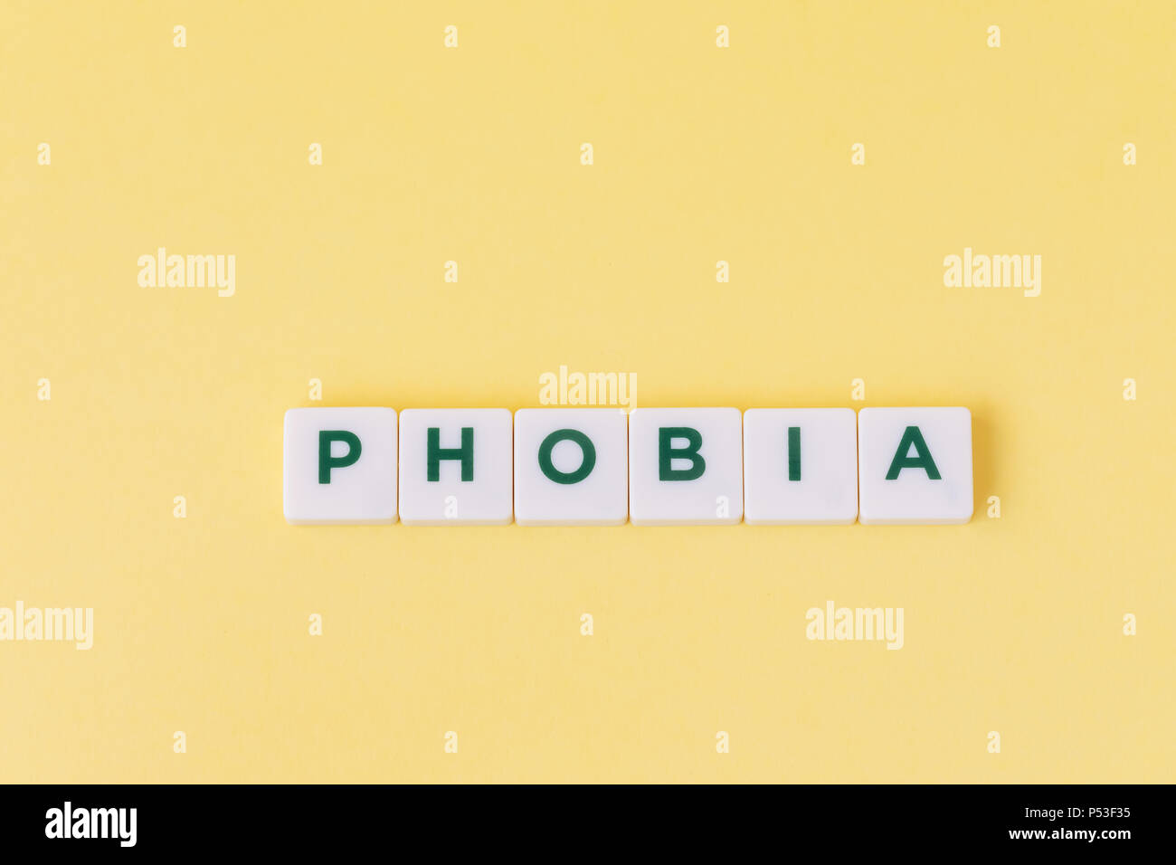 Word Phobia, letters on yellow background, isolated Stock Photo - Alamy