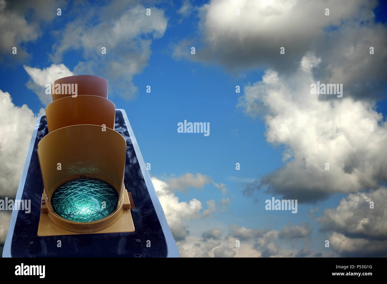 close up shot of traffic light on green Stock Photo - Alamy