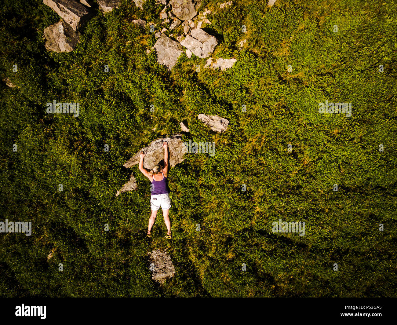 Hanging off cliff hi-res stock photography and images - Alamy