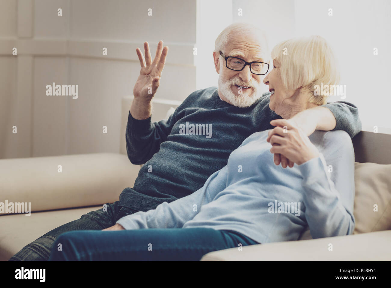 Positive delighted couple talking hi-res stock photography and images ...