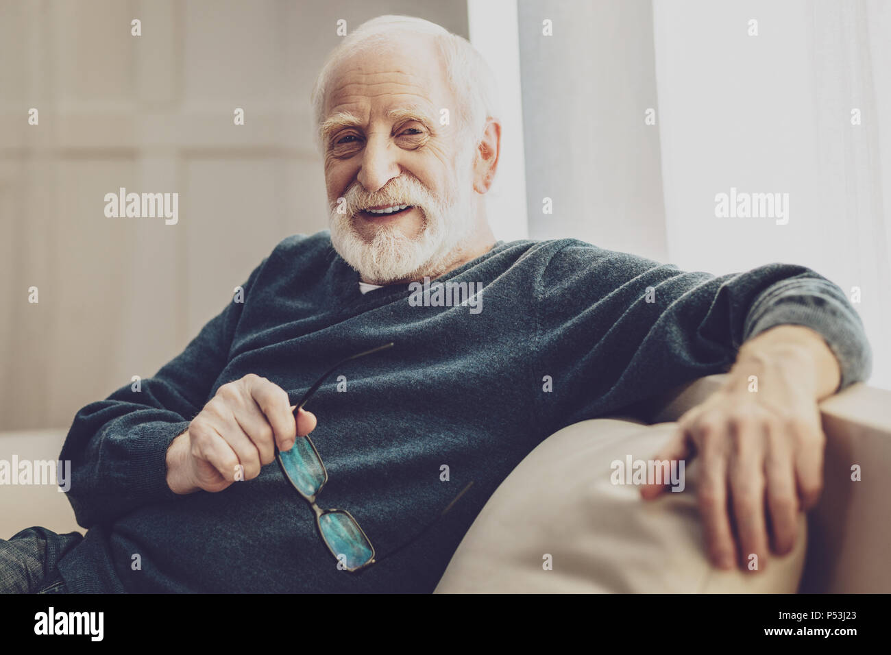 Happy positive man smiling to you Stock Photo - Alamy