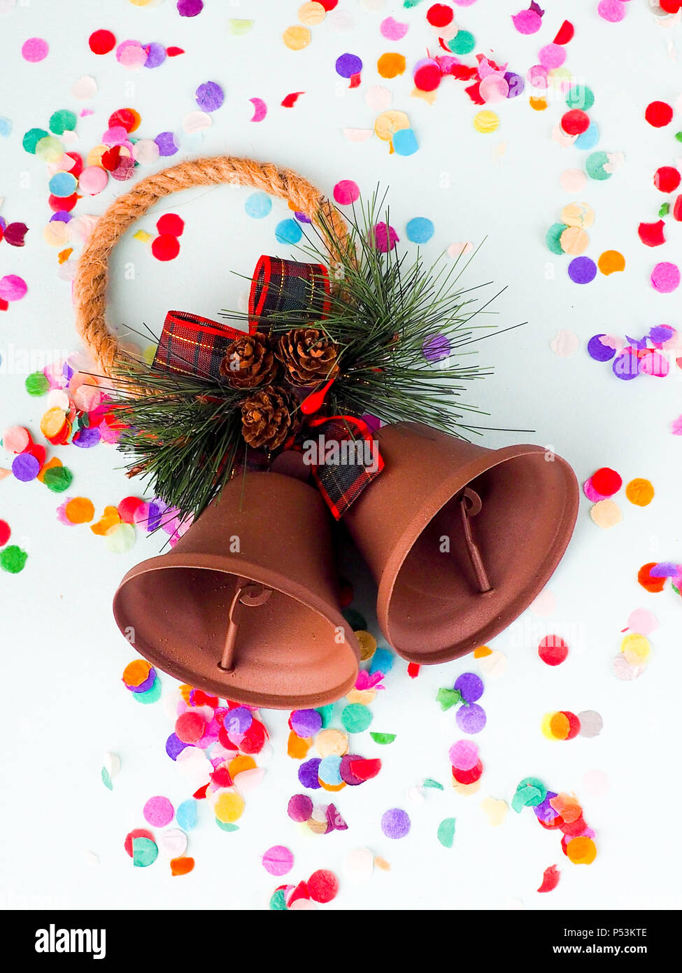 Christmas bells on colored confetti background, Christmas concept Stock ...