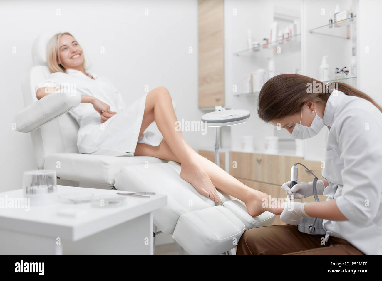 Smiling blondie woman relaxing at beauty salon, caring about her health ...