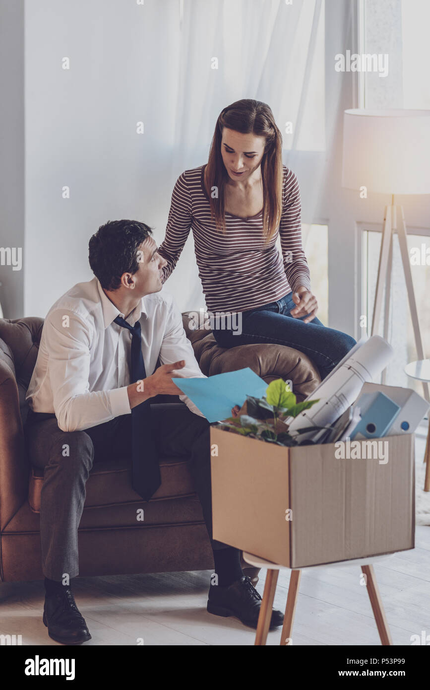 Nice young woman supporting her husband Stock Photo - Alamy