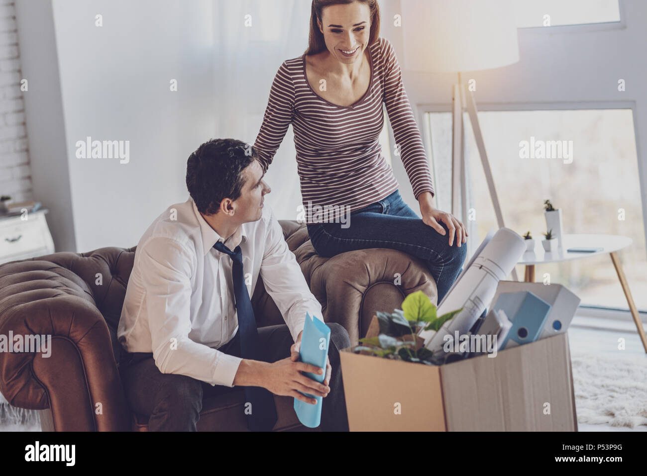 Positive young colleague supporting her friend Stock Photo - Alamy