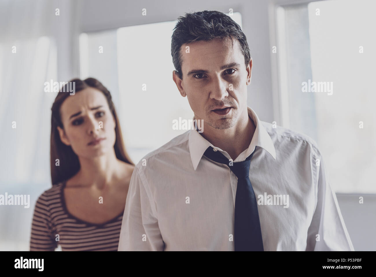 Sad young man looking at you Stock Photo - Alamy
