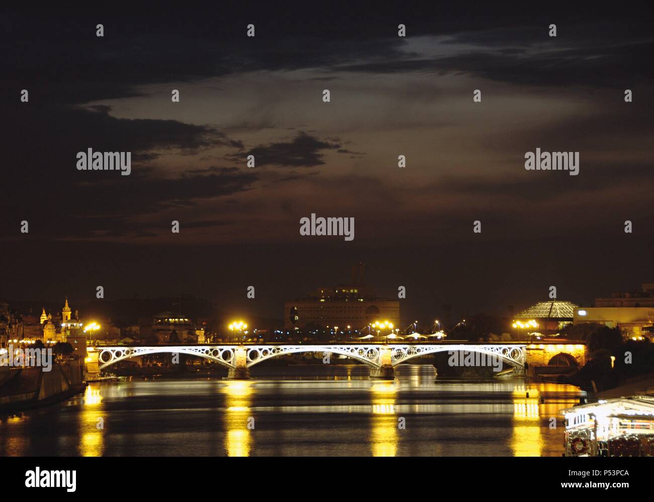 Spain. Andalusia. Sevilla. Night view of Isabel II Bridge, also known ...