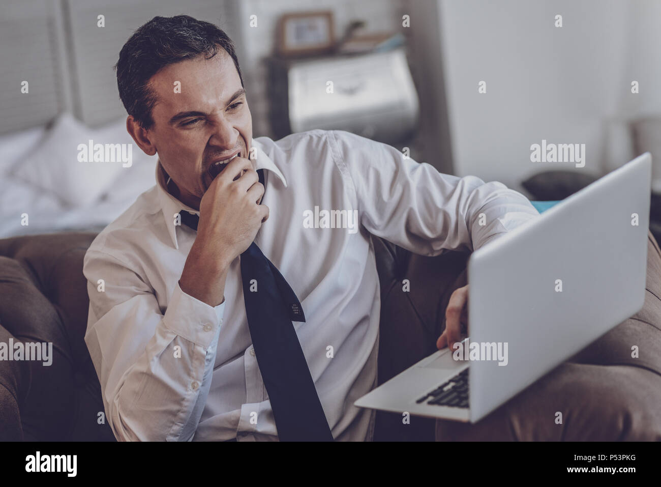 Unhappy nervous man biting his finger Stock Photo - Alamy