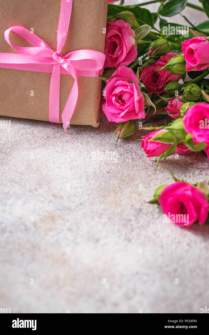 Pink roses and gift boxes with ribbons Stock Photo - Alamy