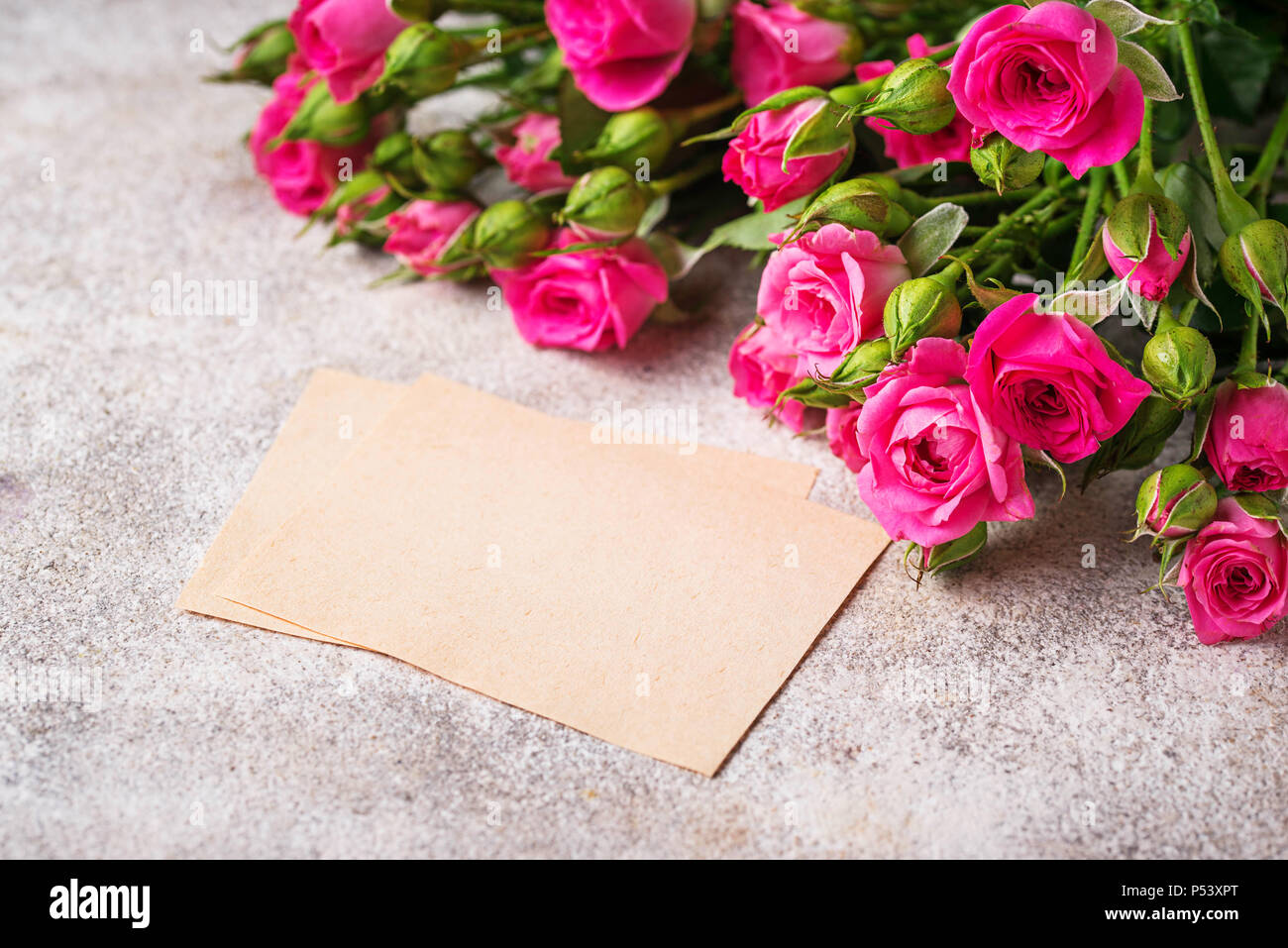 Pink roses and greeting card Stock Photo - Alamy