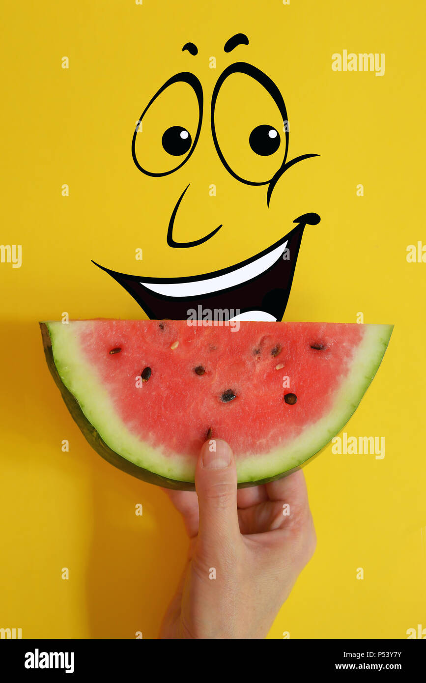 Concept with hand holding watermelon slice over cartoon face Stock ...