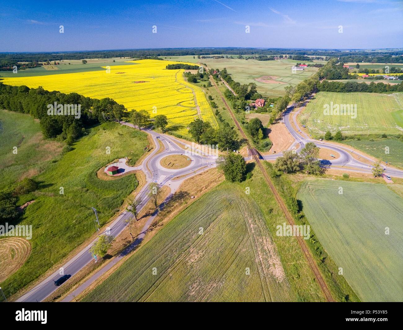 Aerial view of roundabout circles, railroad line and bike lanes near ...