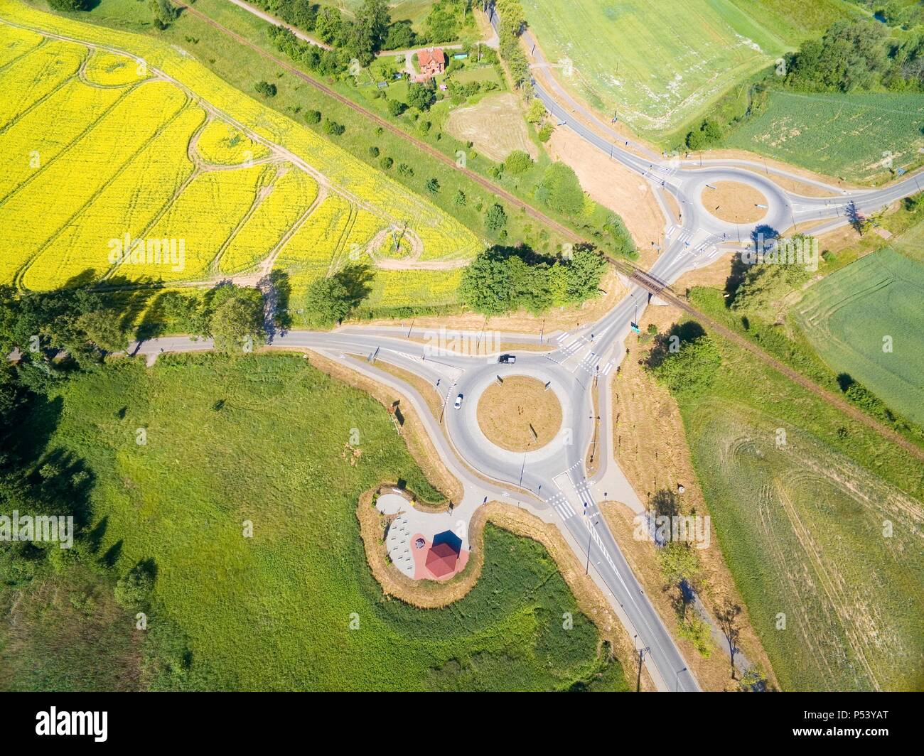 Aerial view of roundabout circles, railroad line and bike lanes near ...