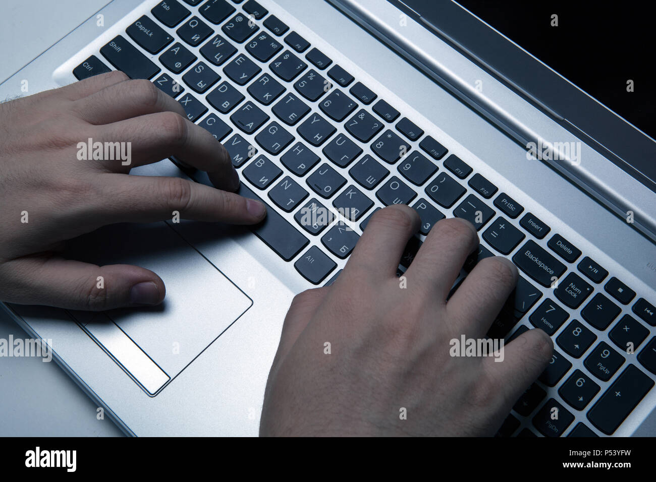 man is typing on a laptop keyboard Stock Photo - Alamy